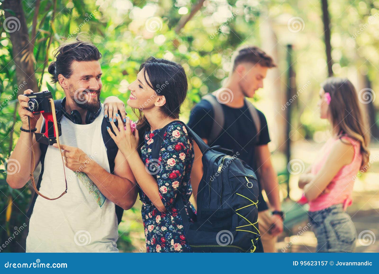 Friends or Couples Having Fun with Photo Camera in Park Stock Image ...