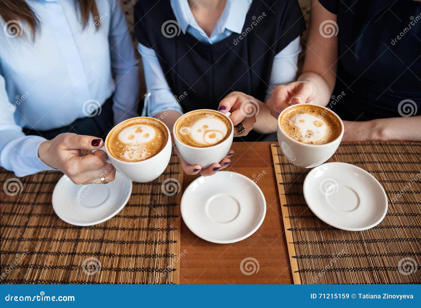 Friends with Cups of Coffee in Their Hands in a Cafe Stock Image ...