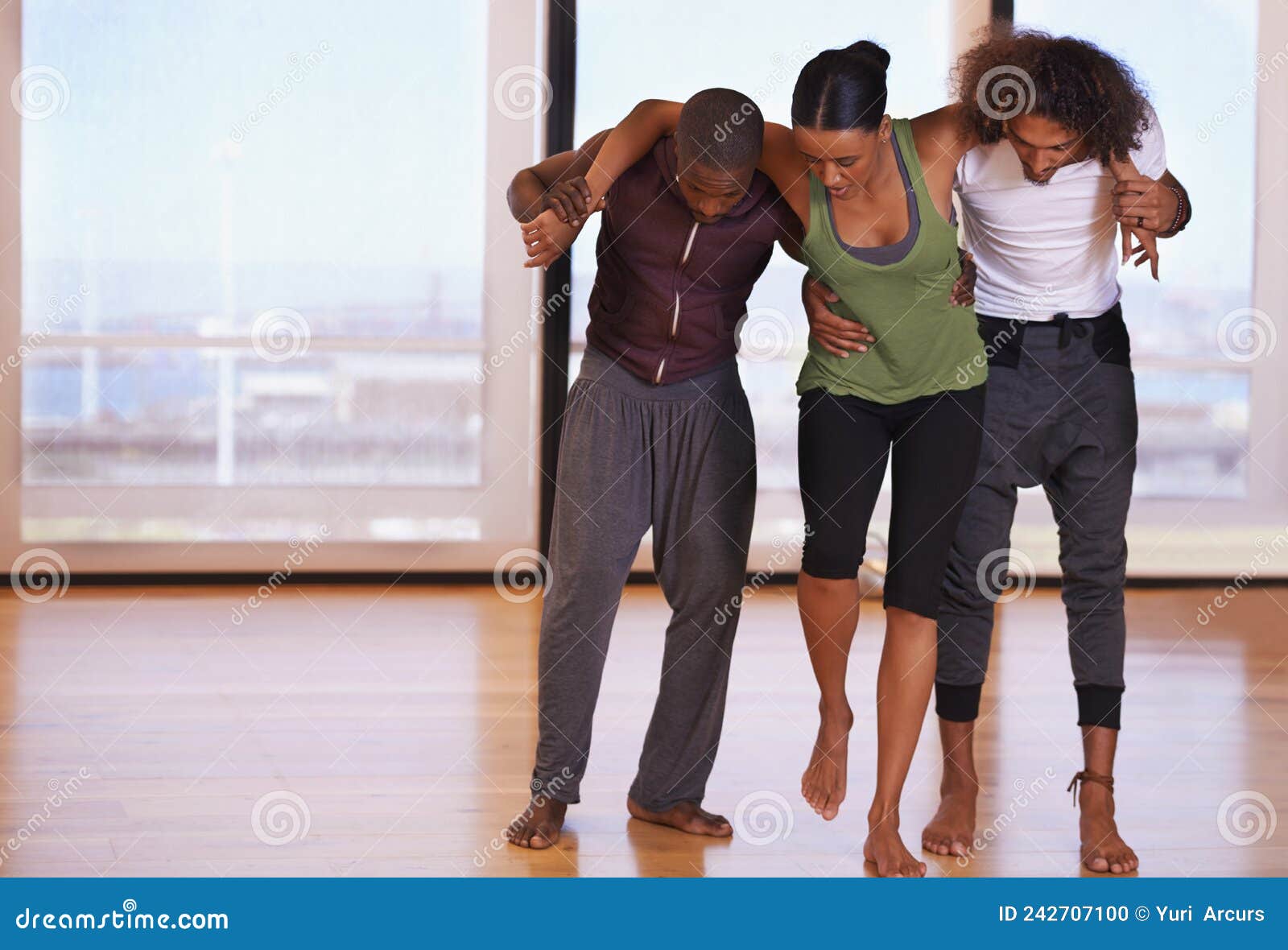 Friends and Dance Partners. Shot of a Group of People Practicing in a ...