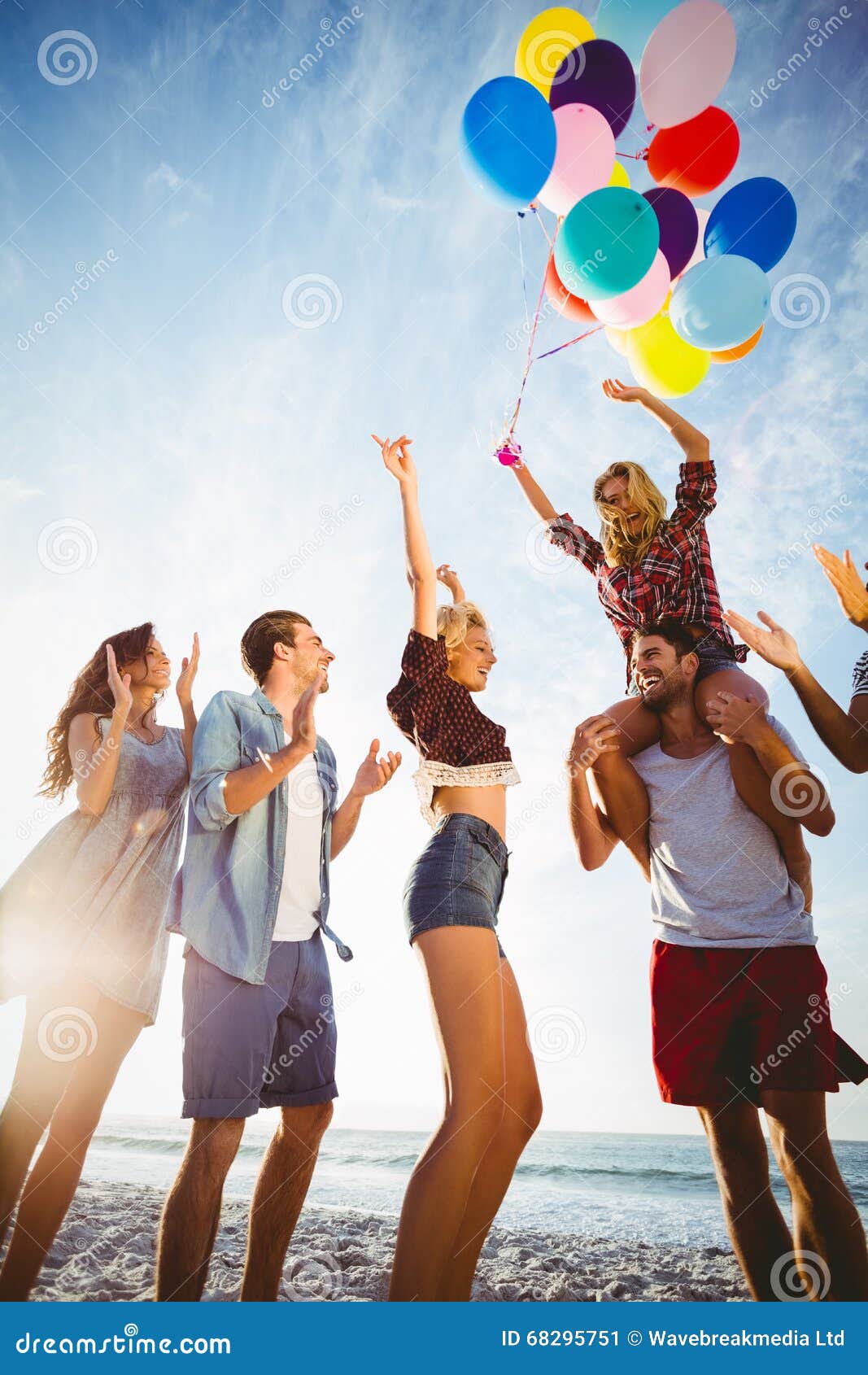 Friends Dancing on Sand with Balloon Stock Image - Image of caucasian ...