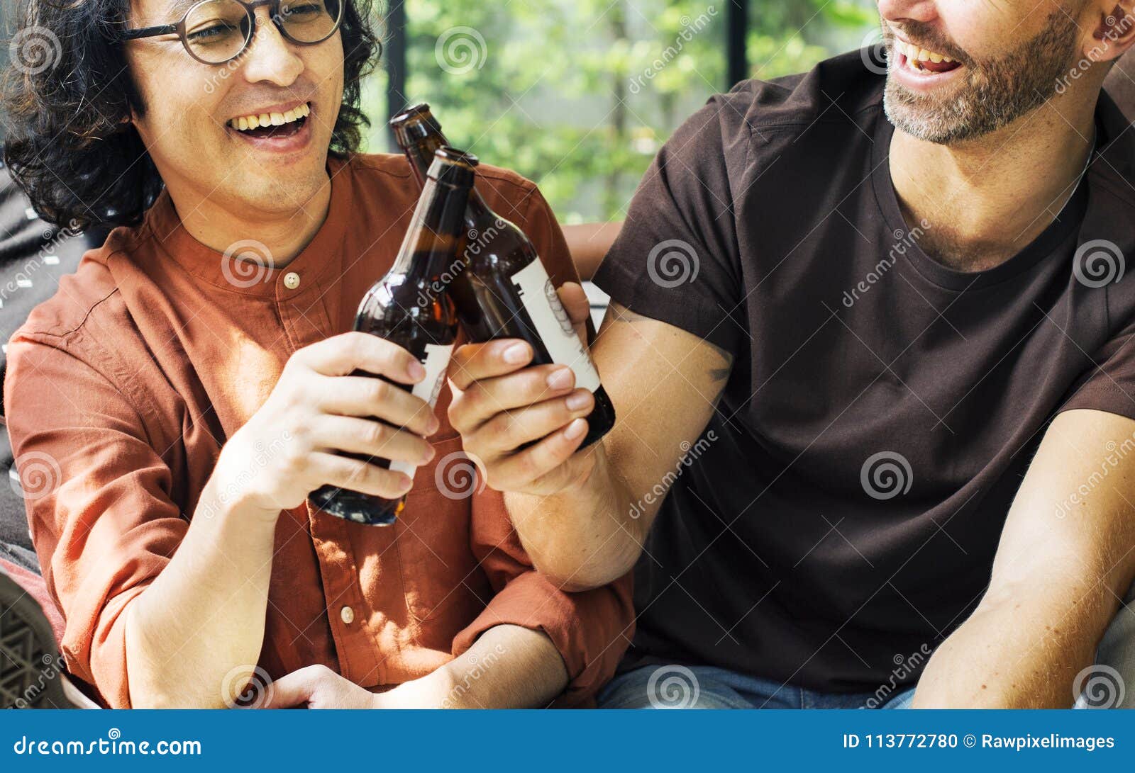 Friends Drinking Beer Together Indoors Stock Photo - Image of holding ...
