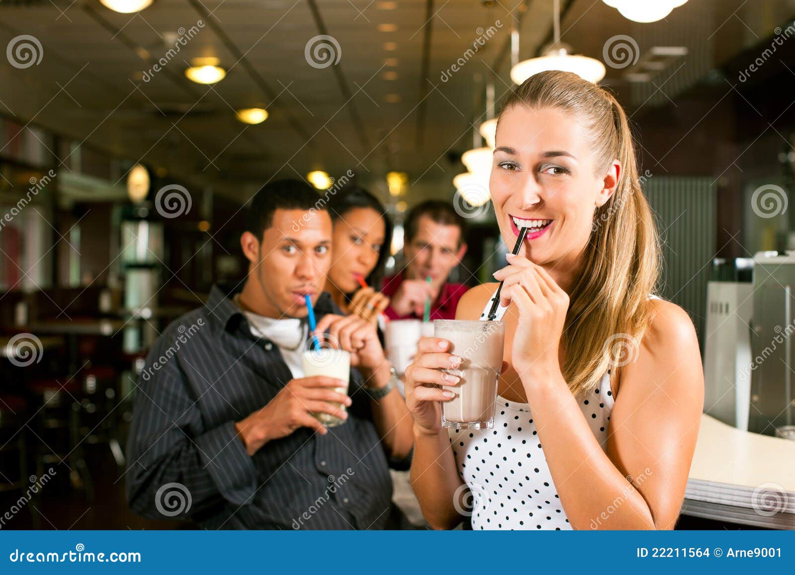 Friends Drinking Milkshakes in a Bar Stock Photo - Image of beautiful ...