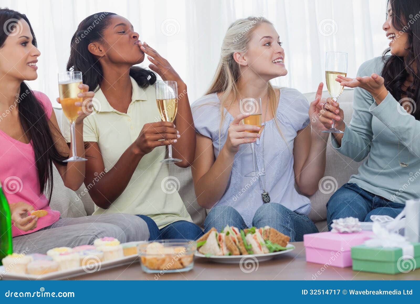 Friends Drinking White Wine and Chatting during Party Stock Image ...