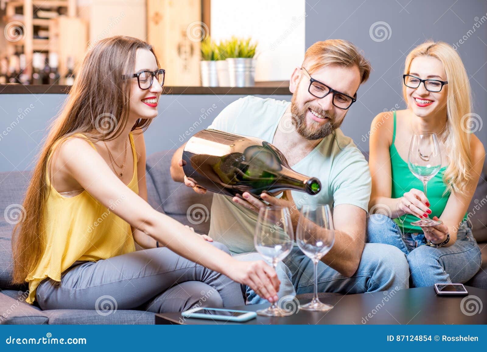 Friends Drinking Wine at Home Stock Photo - Image of friendship, bottle ...