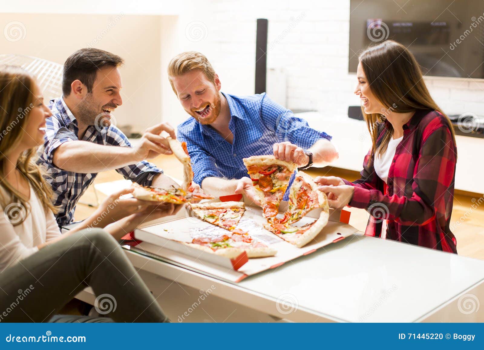 Friends eating pizza stock photo. Image of friendship - 71445220