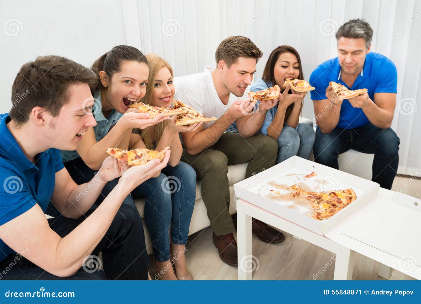 Friends Eating Pizza stock image. Image of casual, mature - 55848871