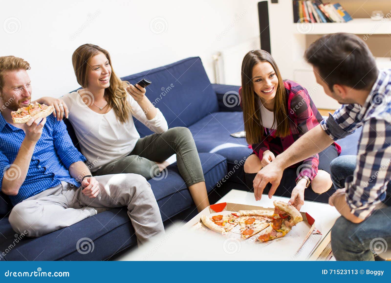 Friends eating pizza stock image. Image of remote, party - 71523113
