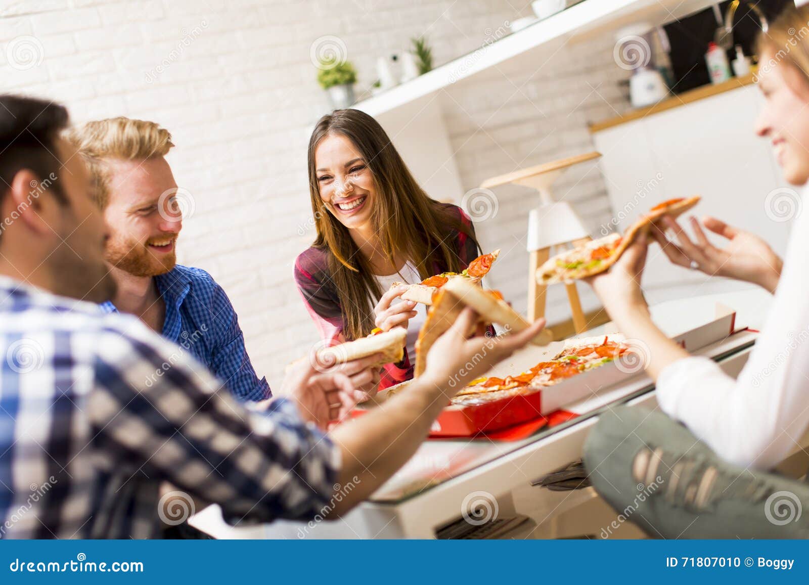 Friends eating pizza stock photo. Image of happy, cheerful - 71807010