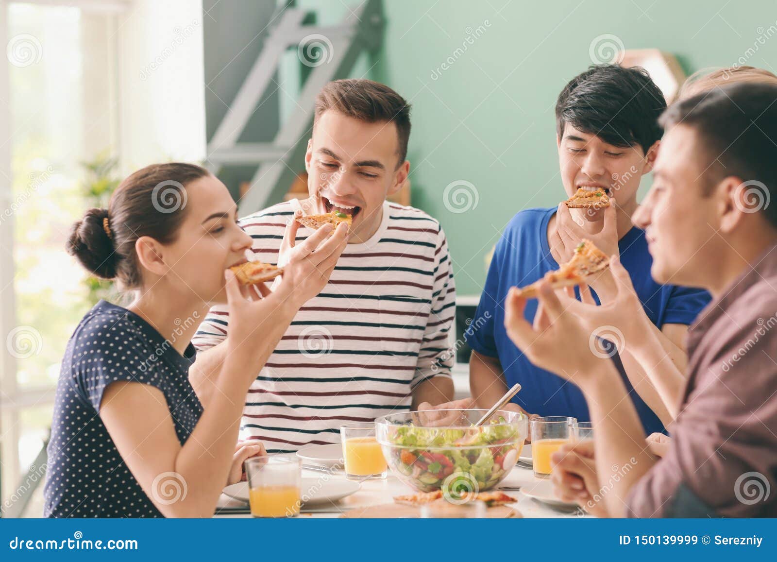 Friends Eating at Table in Kitchen Stock Image - Image of indoors ...
