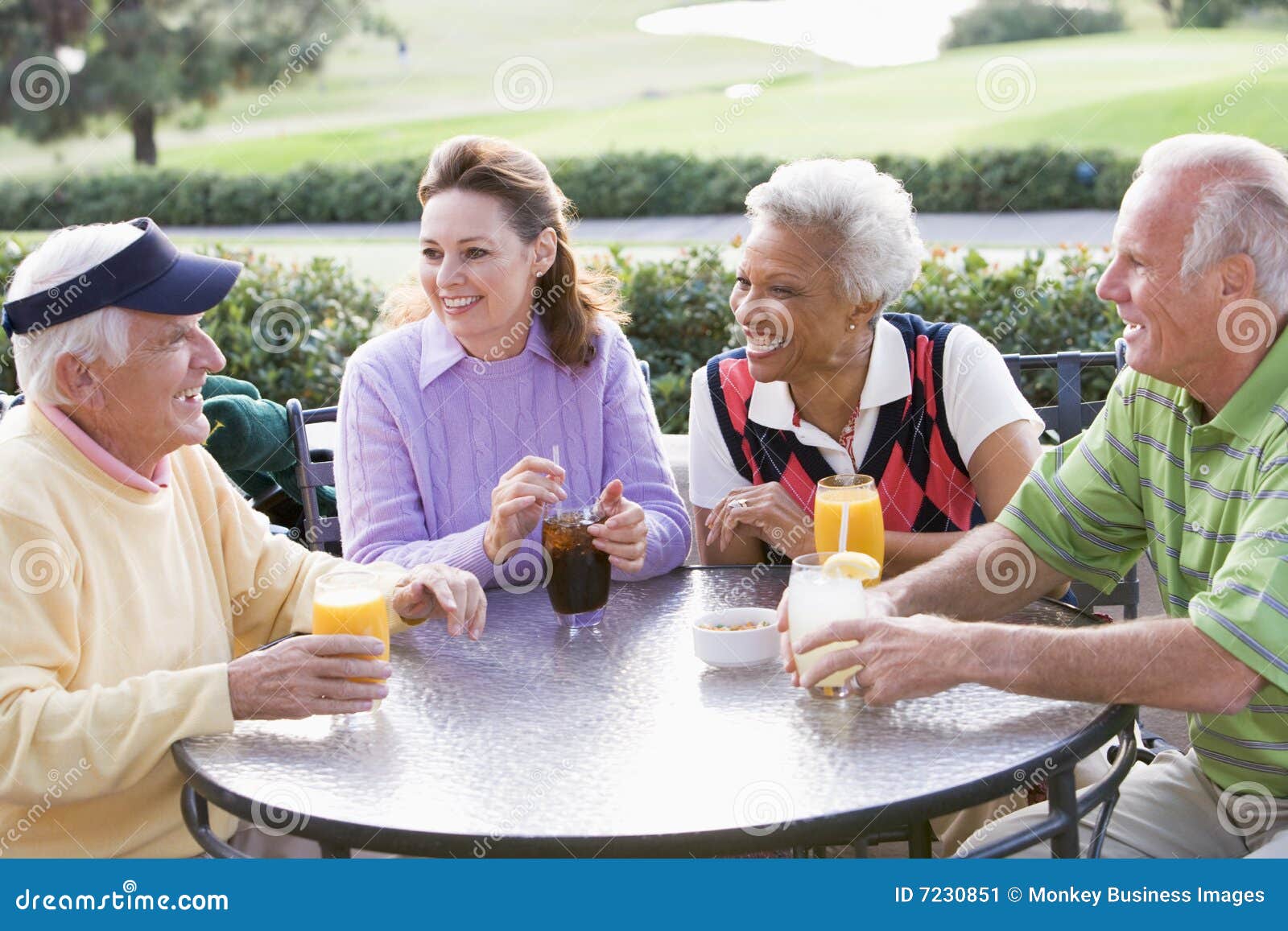 Friends Enjoying a Beverage by a Golf Course Stock Image - Image of ...