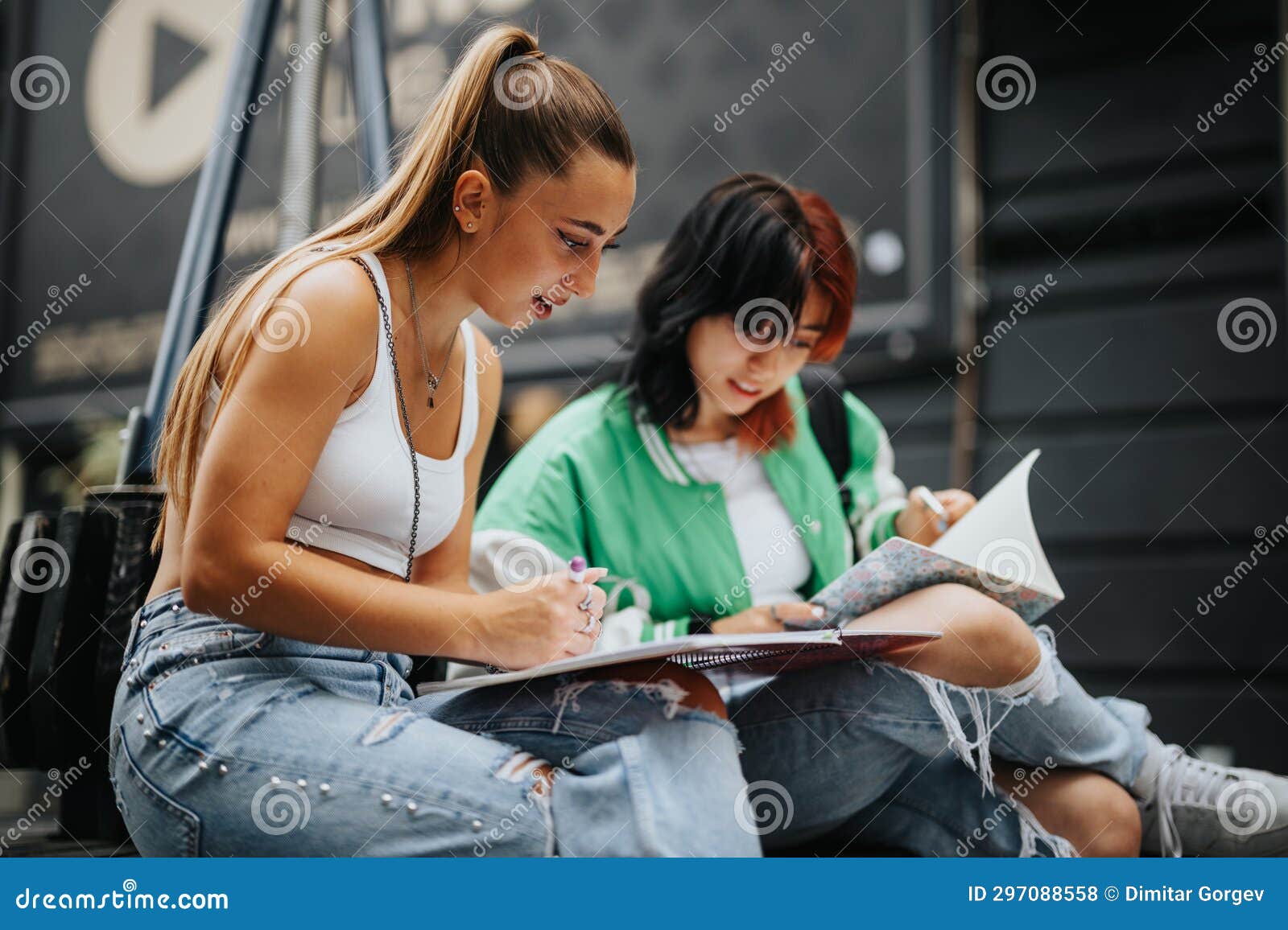 Friends Enjoying an after-Class Study Session Outdoors Stock Photo ...