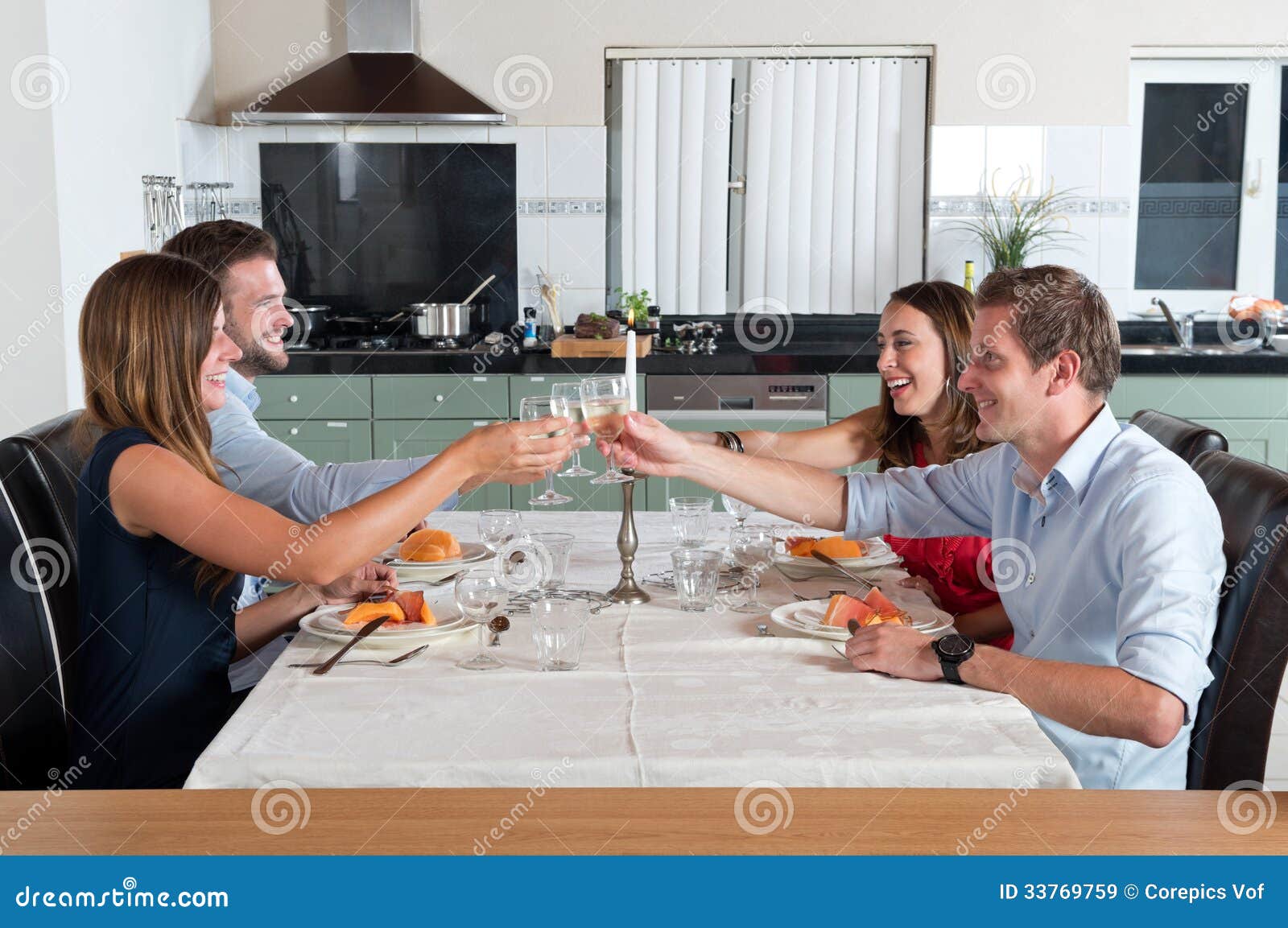 Friends Enjoying Dinner at Home Stock Image - Image of eating, casual ...