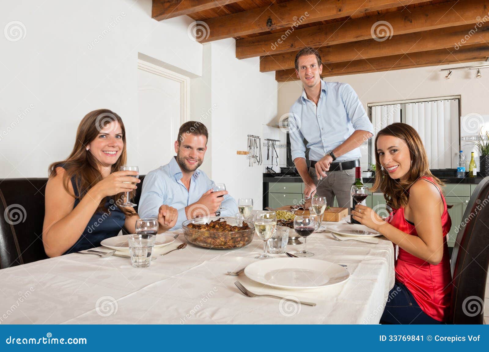 Friends Enjoying Dinner at Home Stock Image - Image of main, enjoyment ...