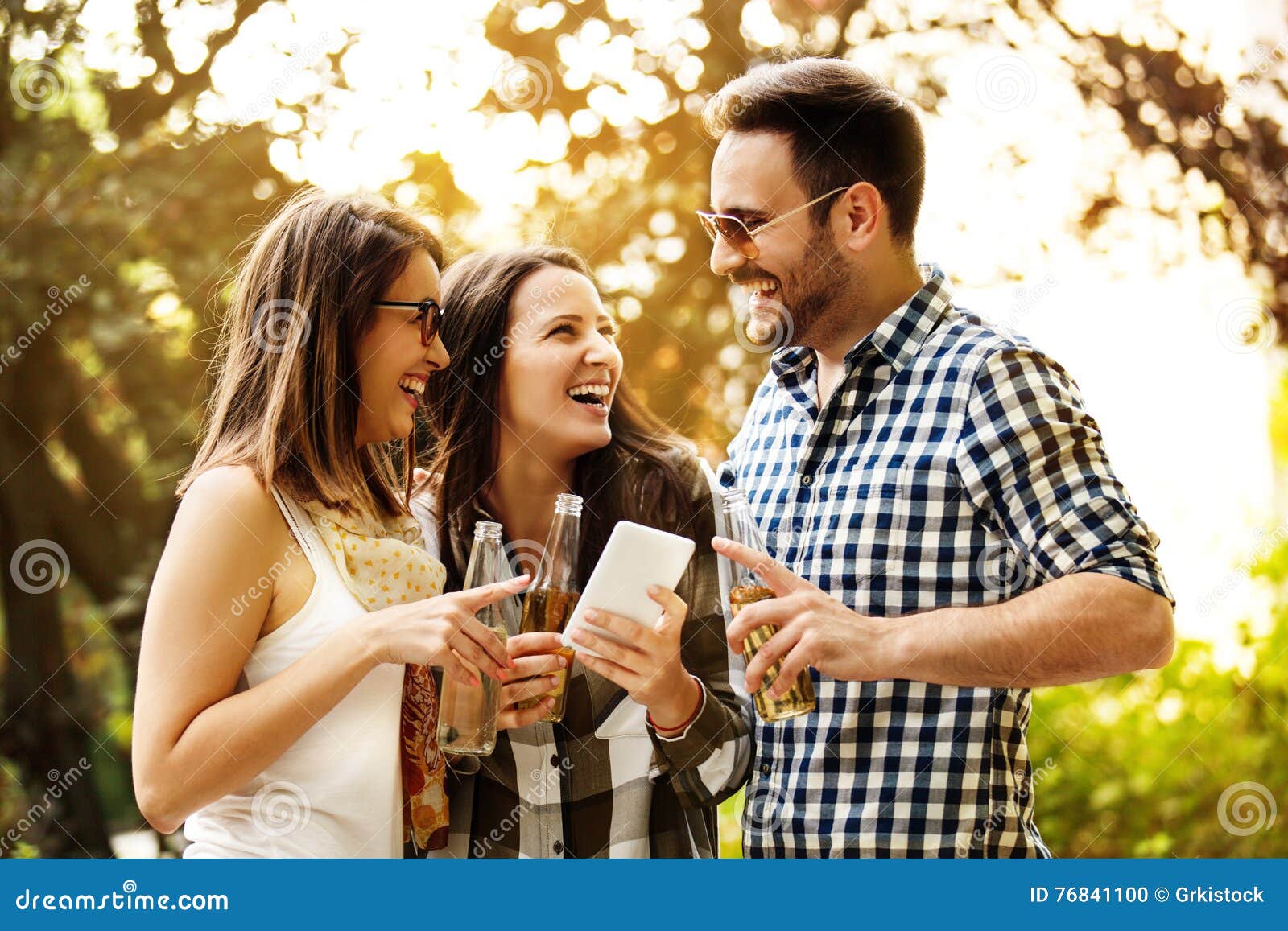 Friends Enjoying Outside stock photo. Image of grass - 76841100