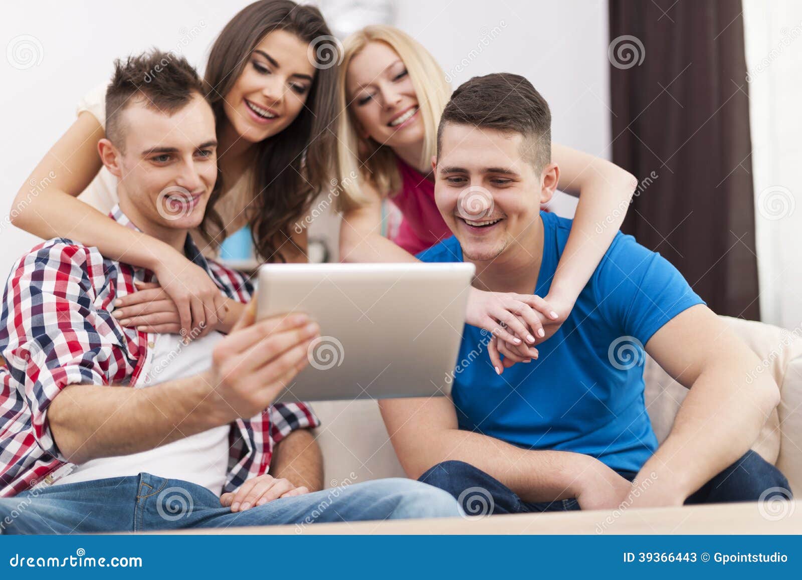 Friends enjoying tablet stock image. Image of display - 39366443