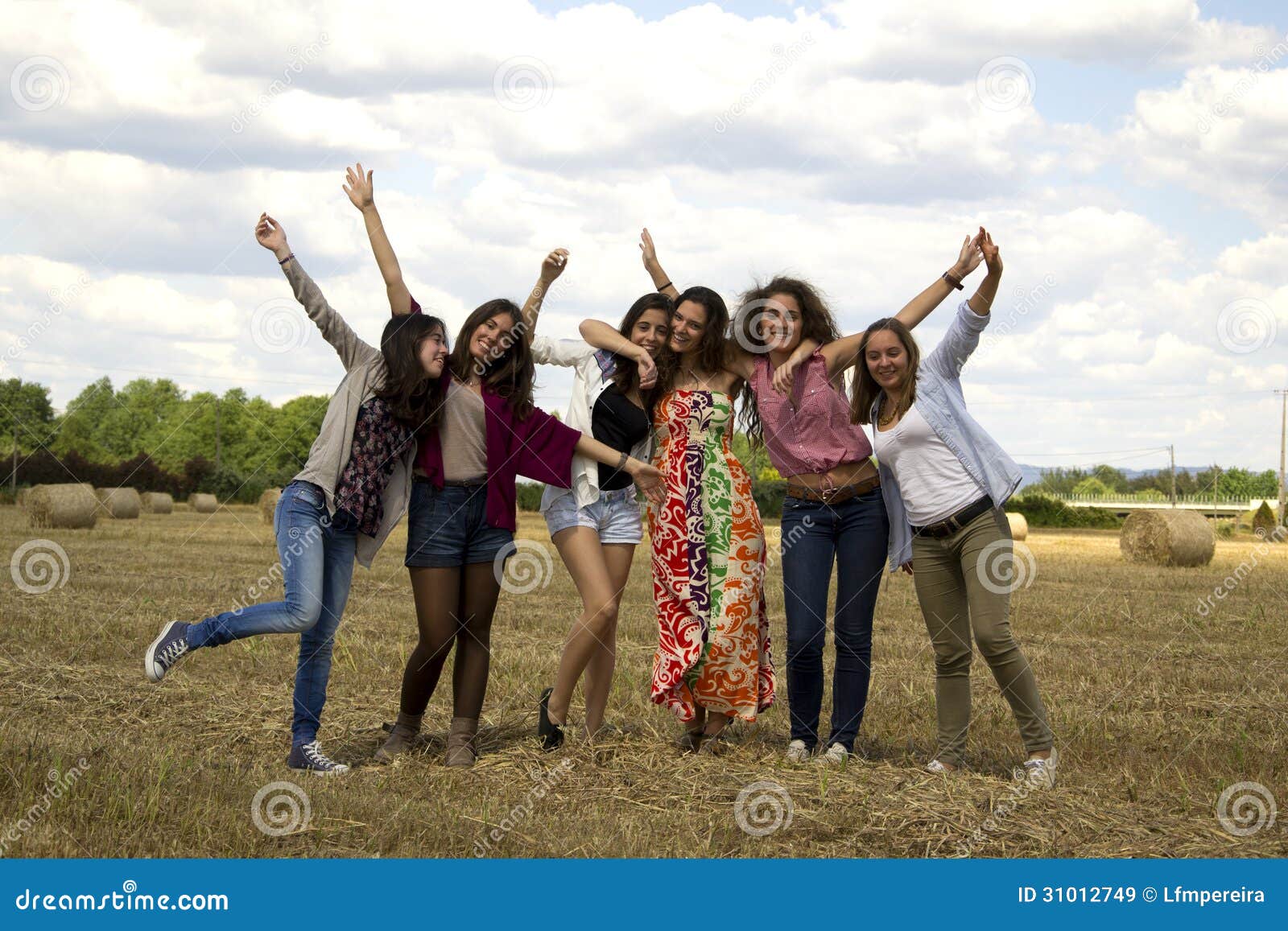 Friends Enjoying Themselves in a Field. Stock Image - Image of beauty ...