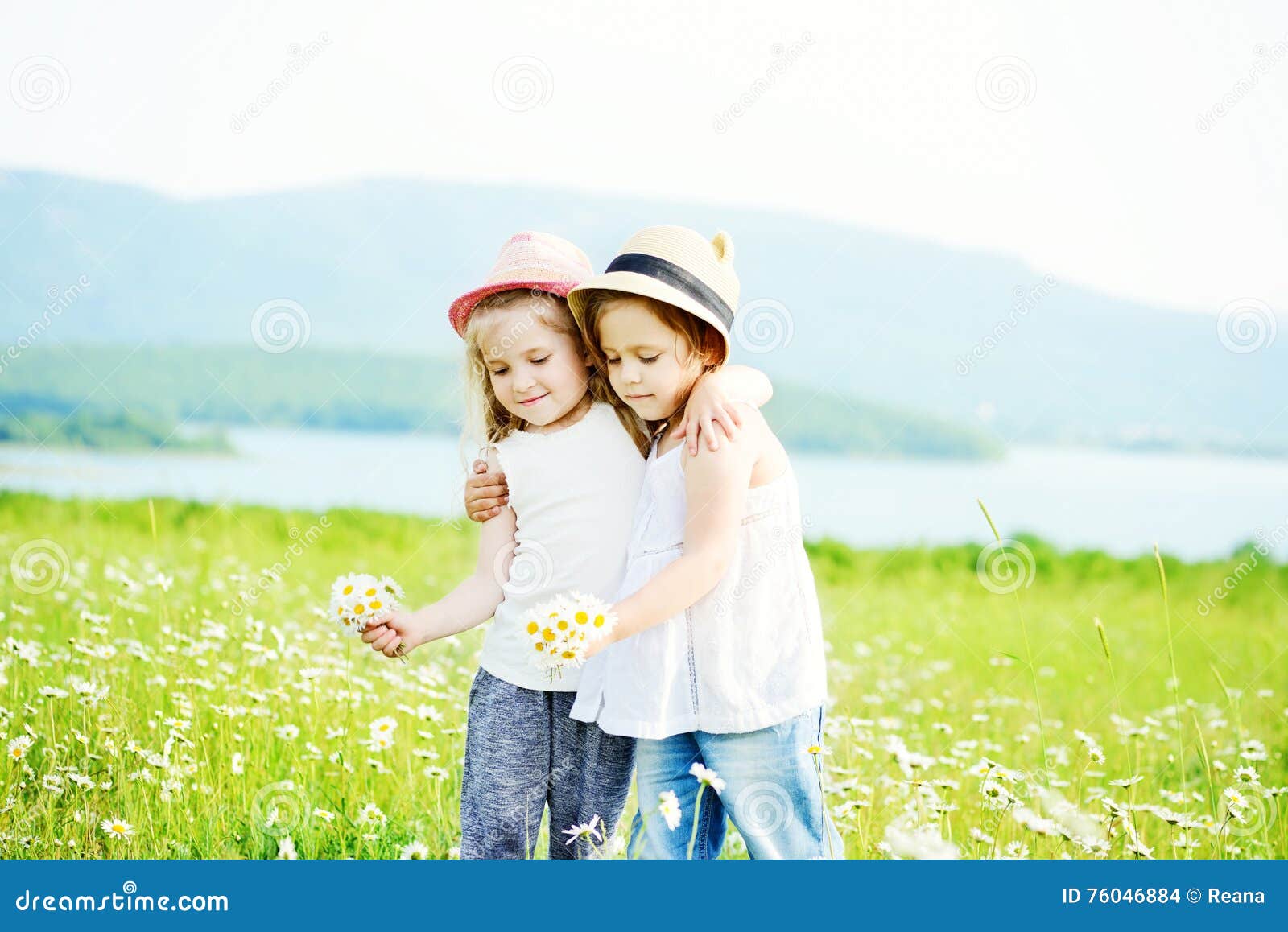Friends in field stock photo. Image of little, flora - 76046884