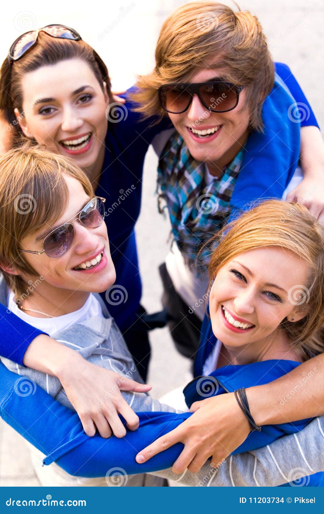Friends forming a huddle stock photo. Image of female - 11203734