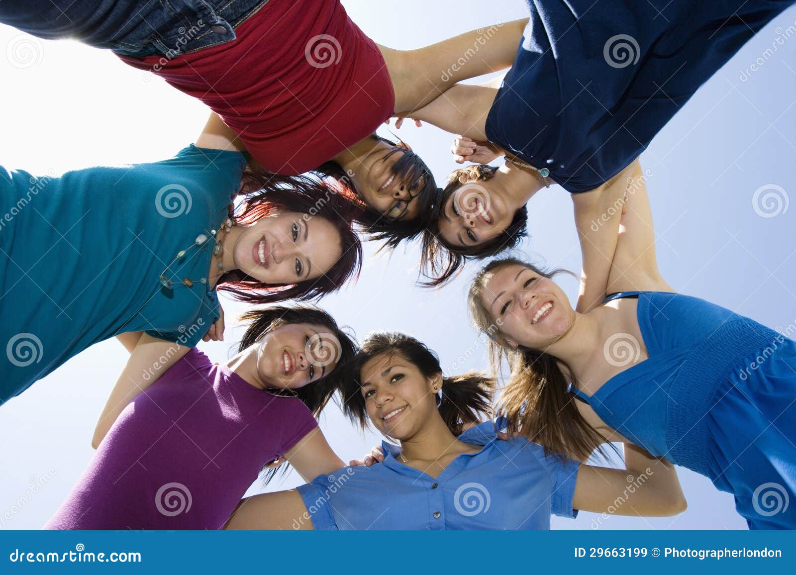 Friends Forming a Huddle stock image. Image of circle - 29663199