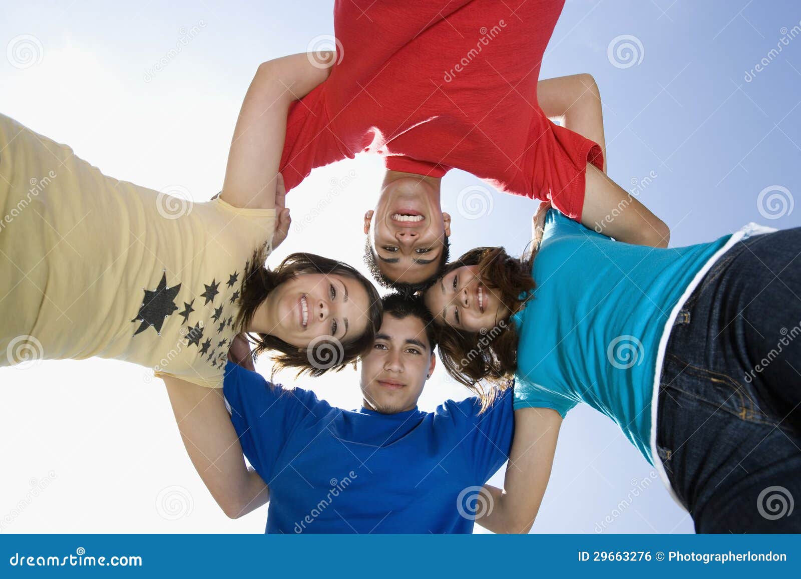 Friends Forming a Huddle Against Sky Stock Photo - Image of teen ...