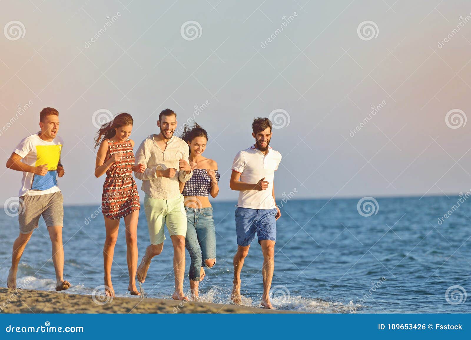 Friends Fun on the Beach Under Sunset Sunlight. Stock Photo - Image of ...