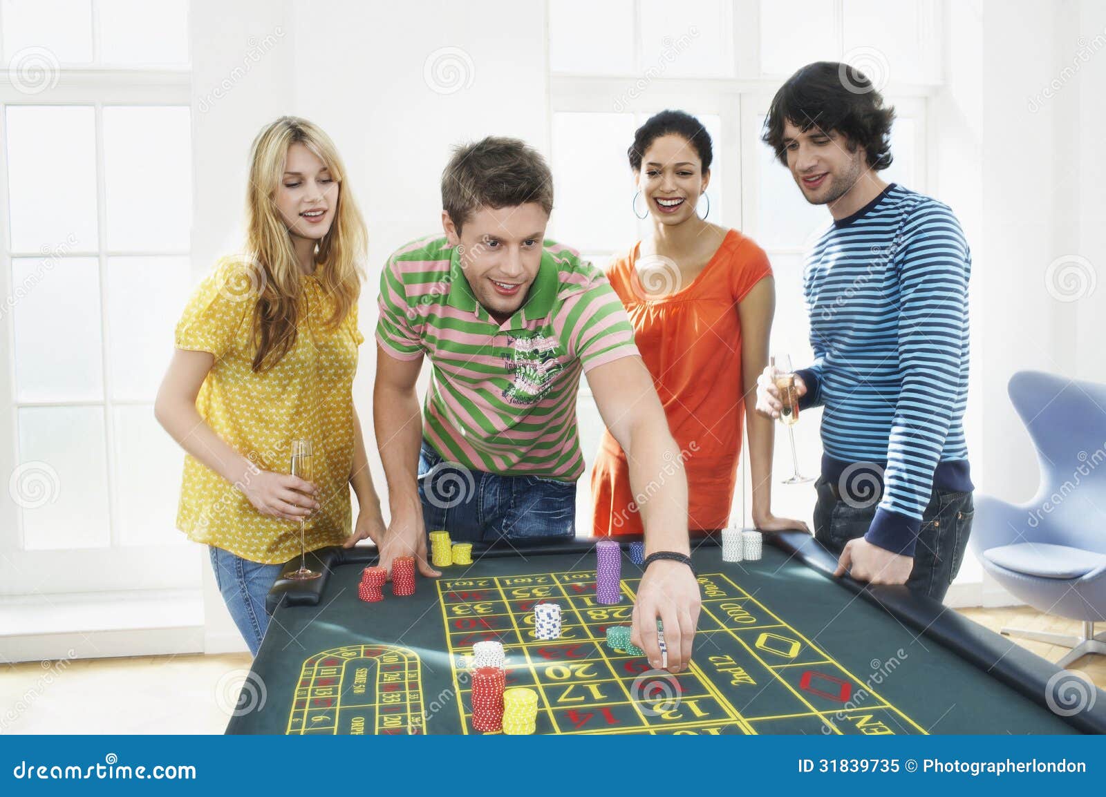 Friends Gambling at Roulette Table Stock Image - Image of interracial ...