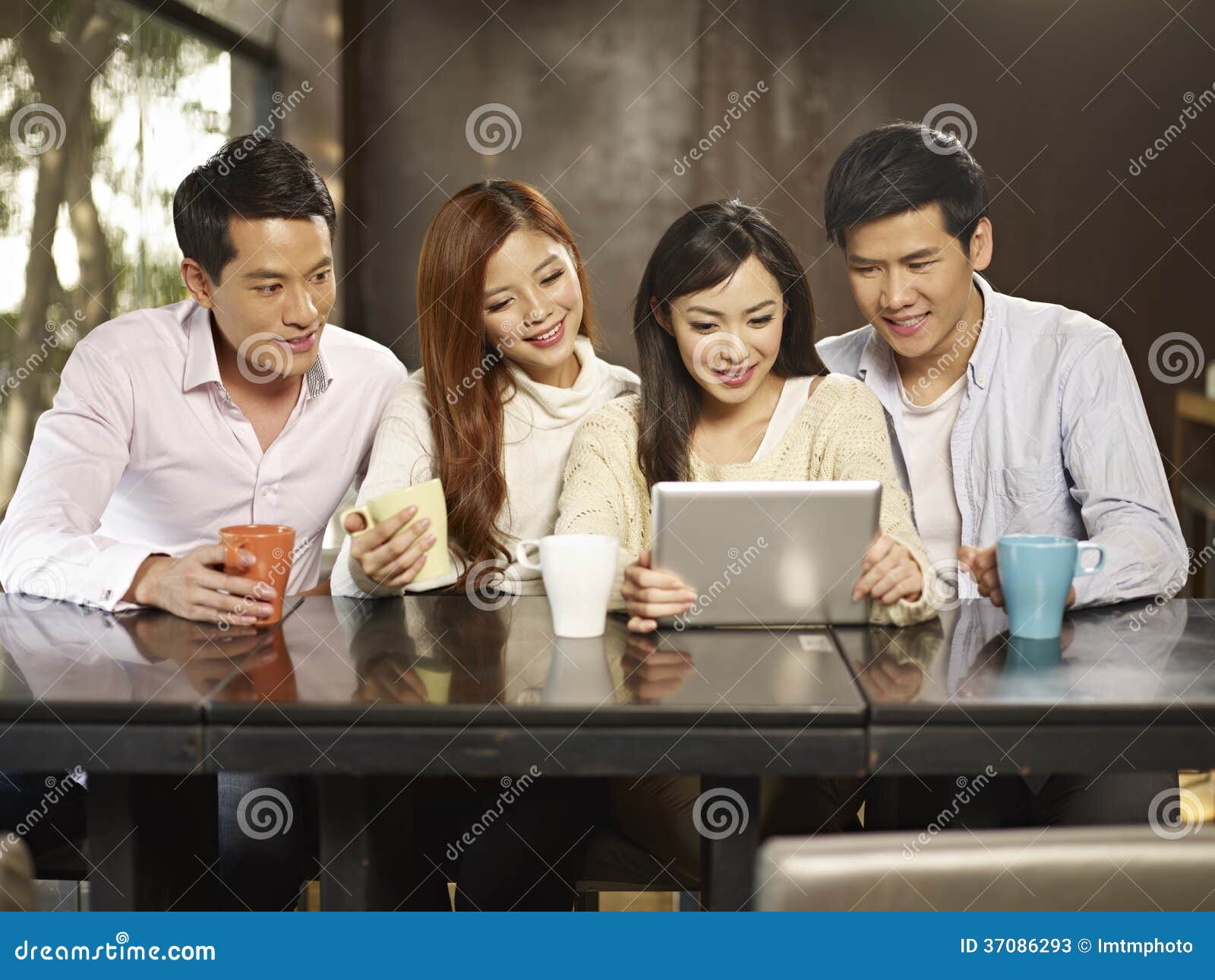 Friends gathering in cafe stock image. Image of browsing - 37086293