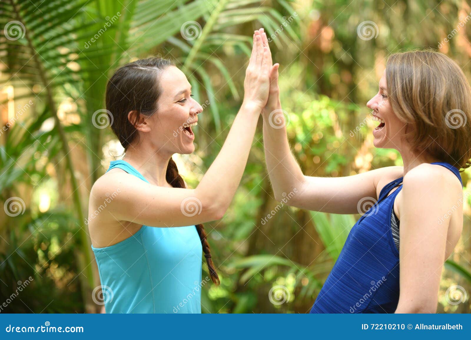 Friends giving a high five stock photo. Image of expression - 72210210