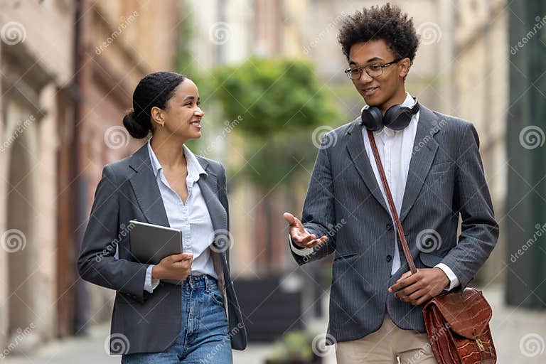 Friends Going Home after Work and Discussing Something Stock Photo ...