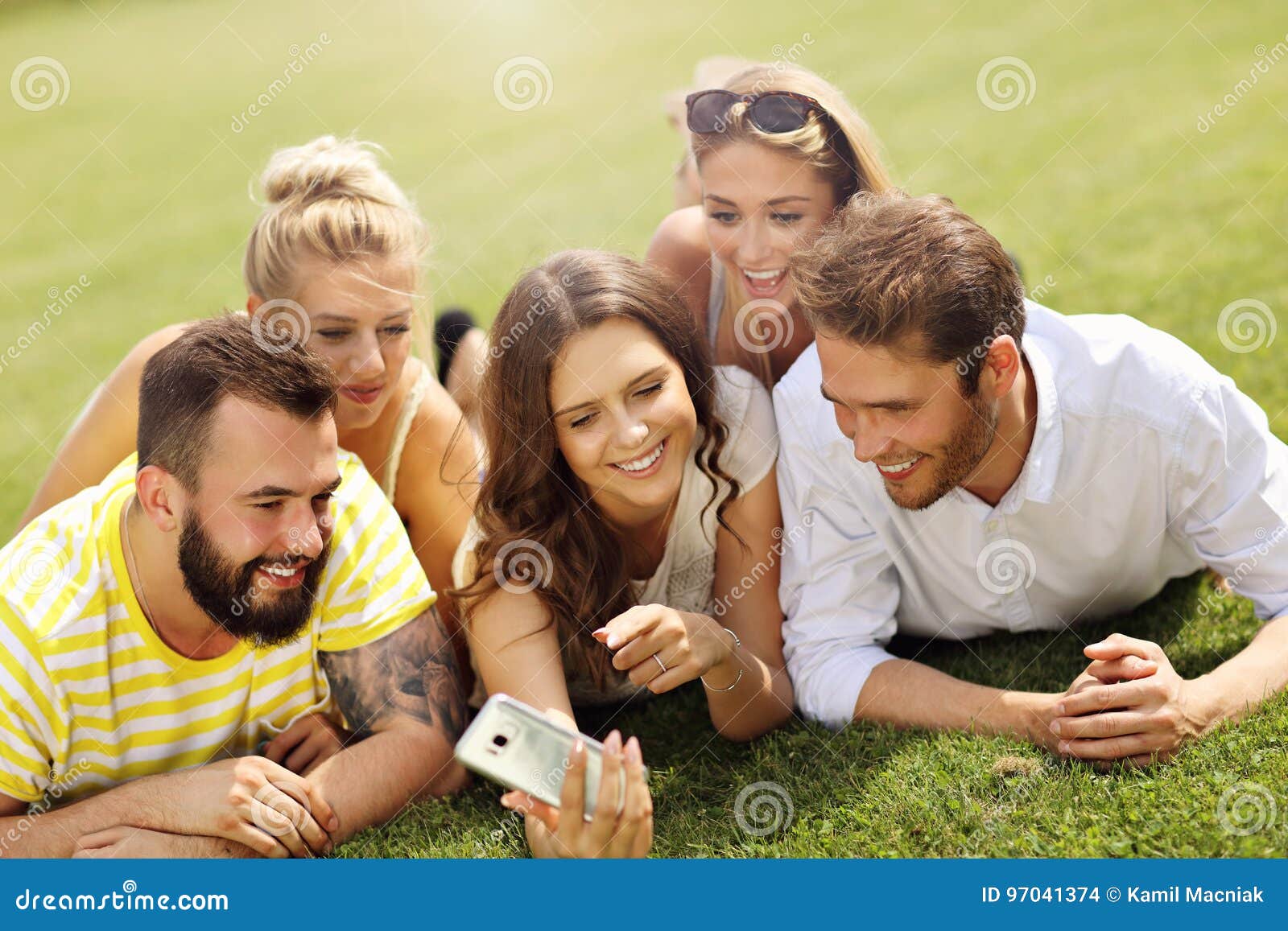 Friends Group Having Fun Together on Grass Stock Photo - Image of ...