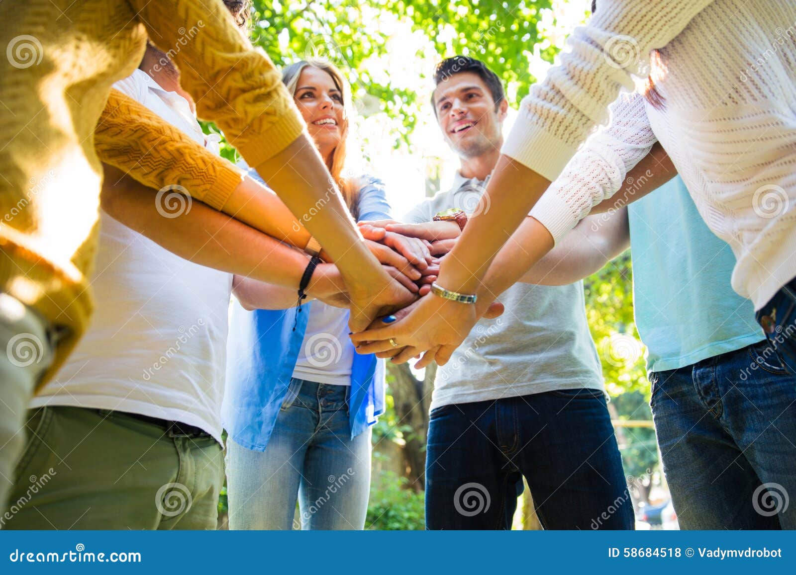 Friends hands together stock photo. Image of friend, green - 58684518