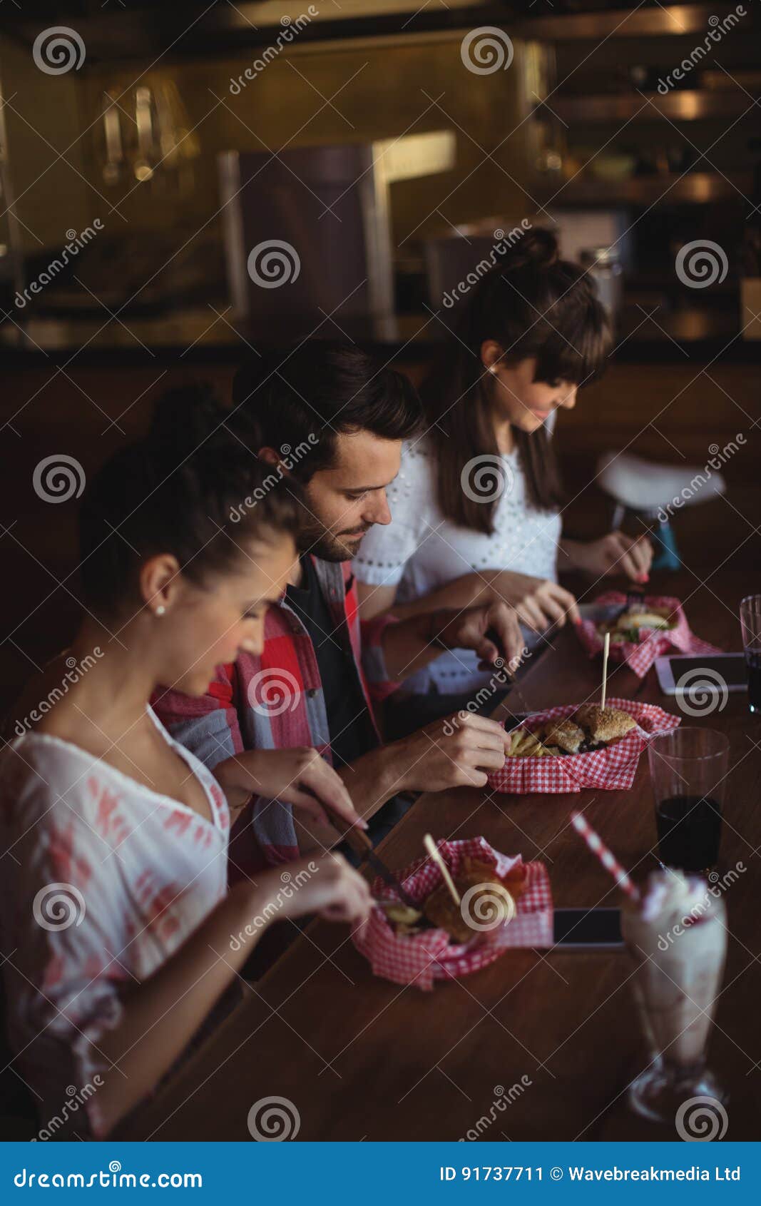 Friends Having Burger Together Stock Image - Image of burger, bonding ...