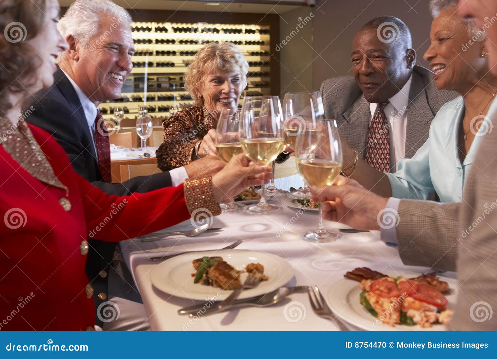 Friends Having Dinner at a Restaurant Stock Photo - Image of older ...