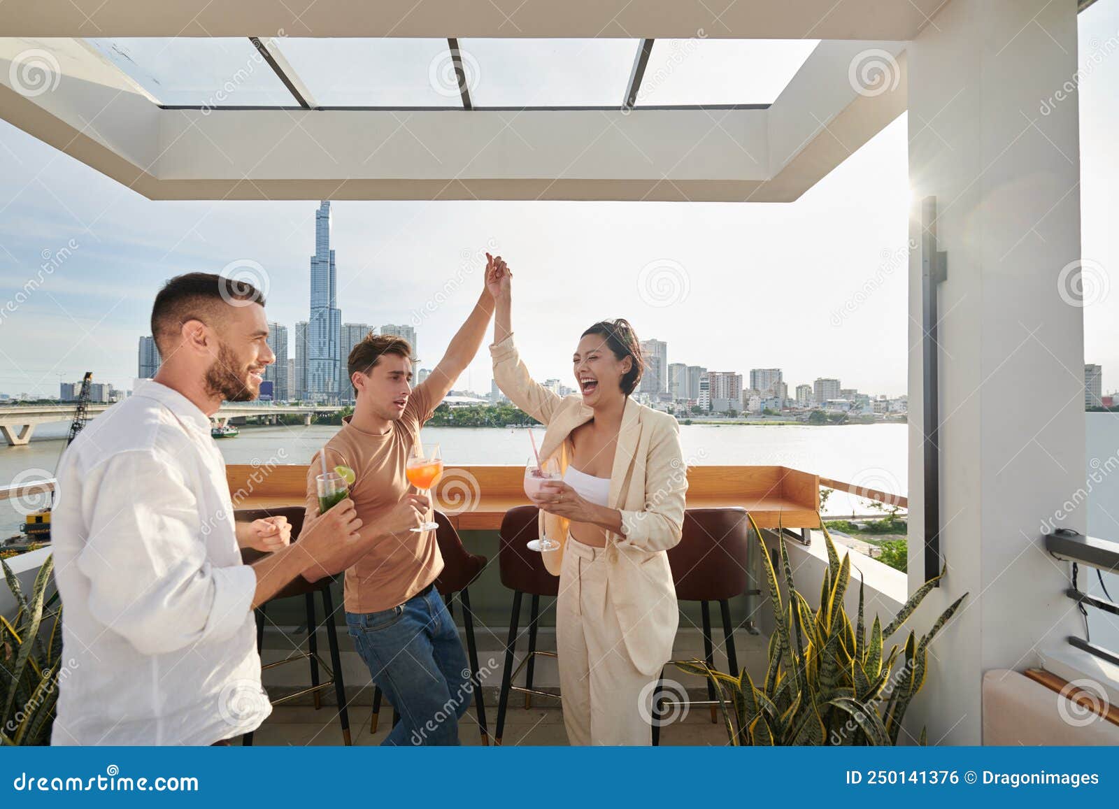 Friends Having Fun in Bar stock photo. Image of table - 250141376