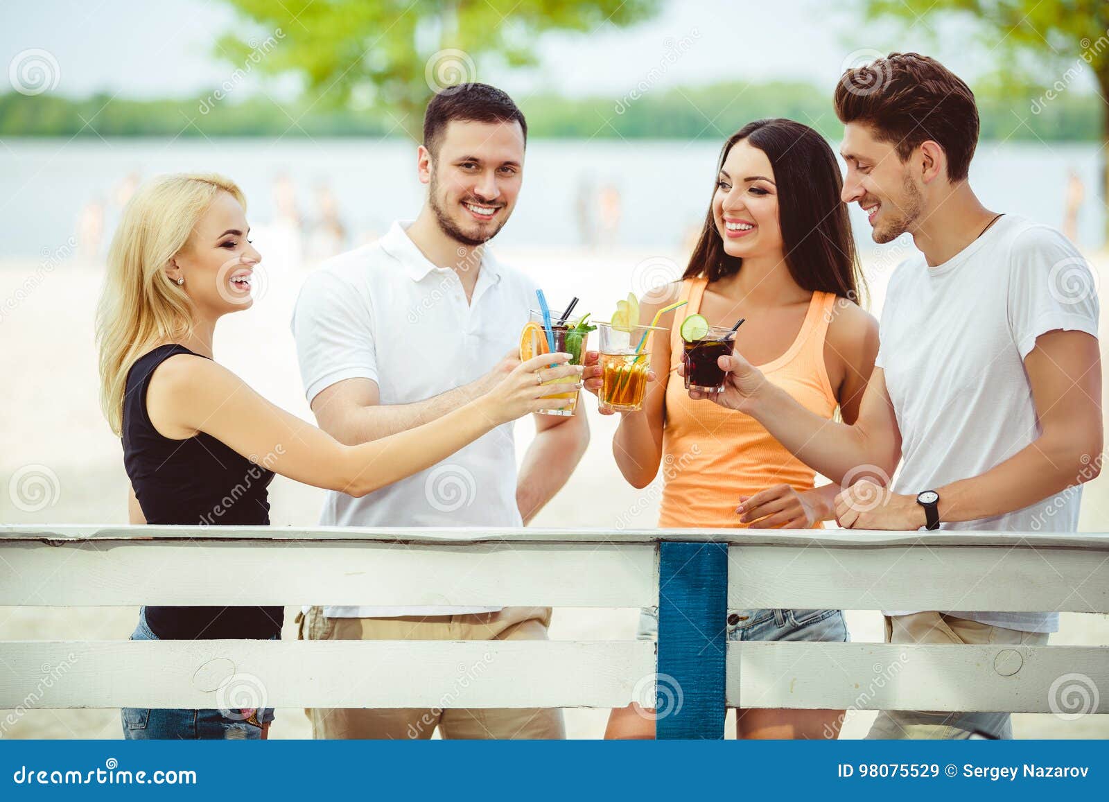 Friends Having Fun at the Bar Outdoors, Drinking Cocktails. Stock Image ...