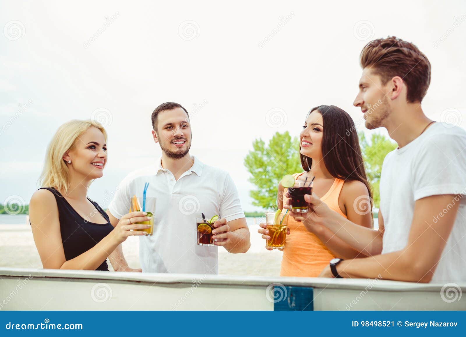 Friends Having Fun at the Bar Outdoors, Drinking Cocktails. Stock Image ...