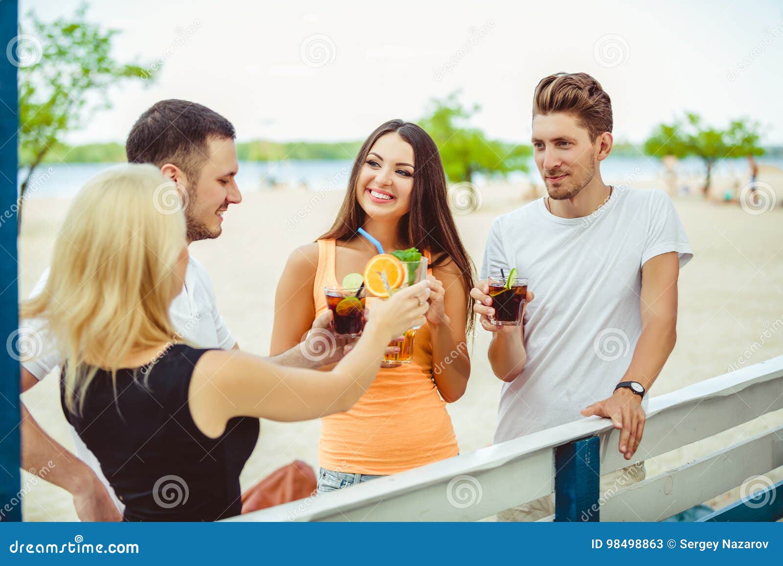 Friends Having Fun at the Bar Outdoors, Drinking Cocktails. Stock Image ...