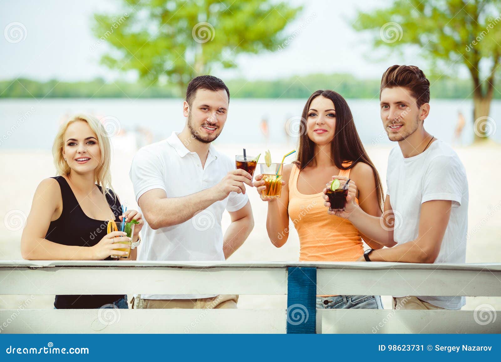 Friends Having Fun at the Bar Outdoors, Drinking Cocktails. Stock Image ...