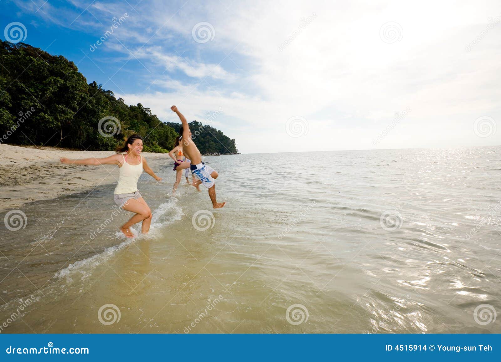 Friends Having Fun Jumping into the Sea Stock Photo - Image of smart ...