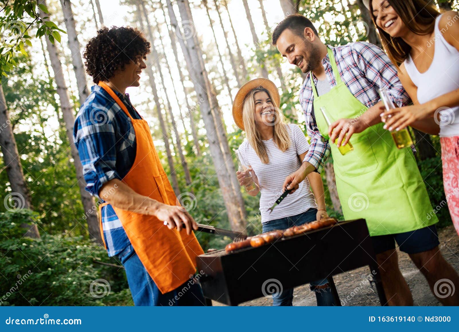 Friends Having Fun in Nature Doing Bbq Stock Photo - Image of ...