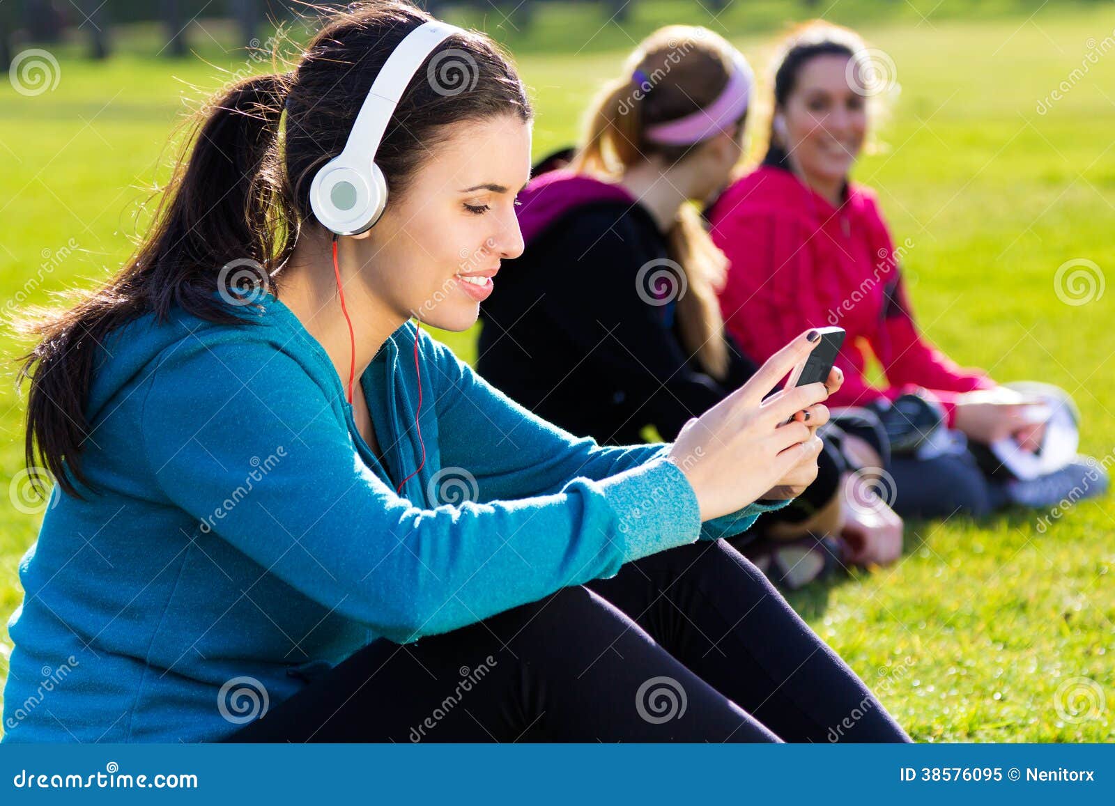 Friends Having Fun with Smartphones after Exercise Stock Image - Image ...