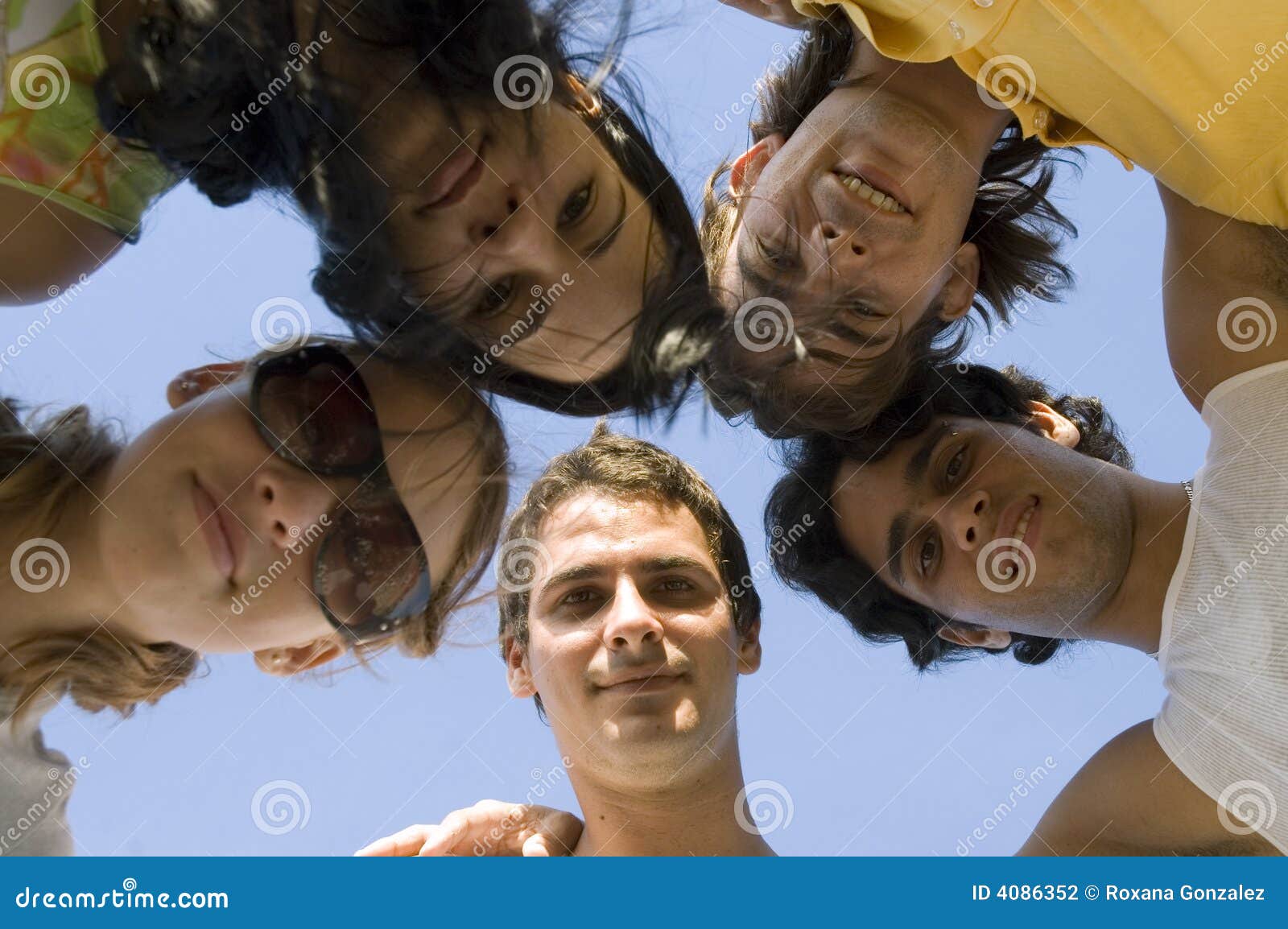 Friends with Heads Together Stock Photo - Image of friends, outdoors ...