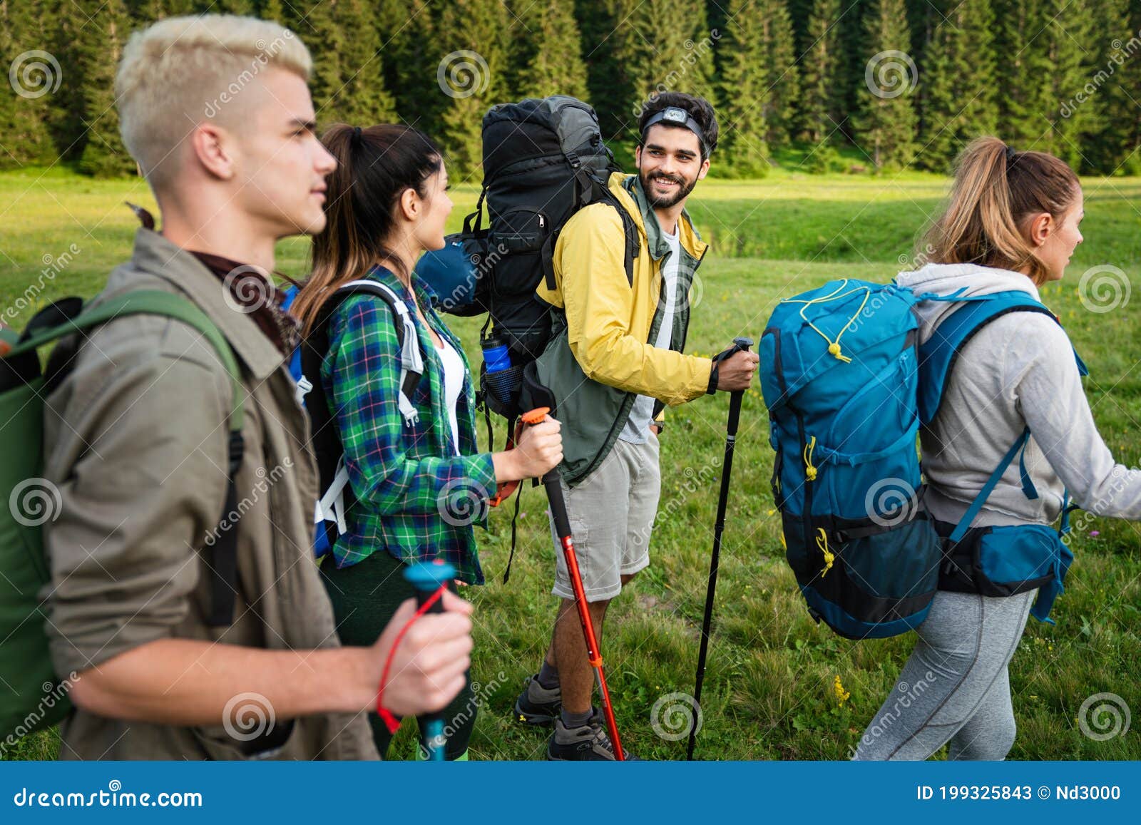 Group of Friends Hiking Together Outdoors Exploring the Wilderness and ...