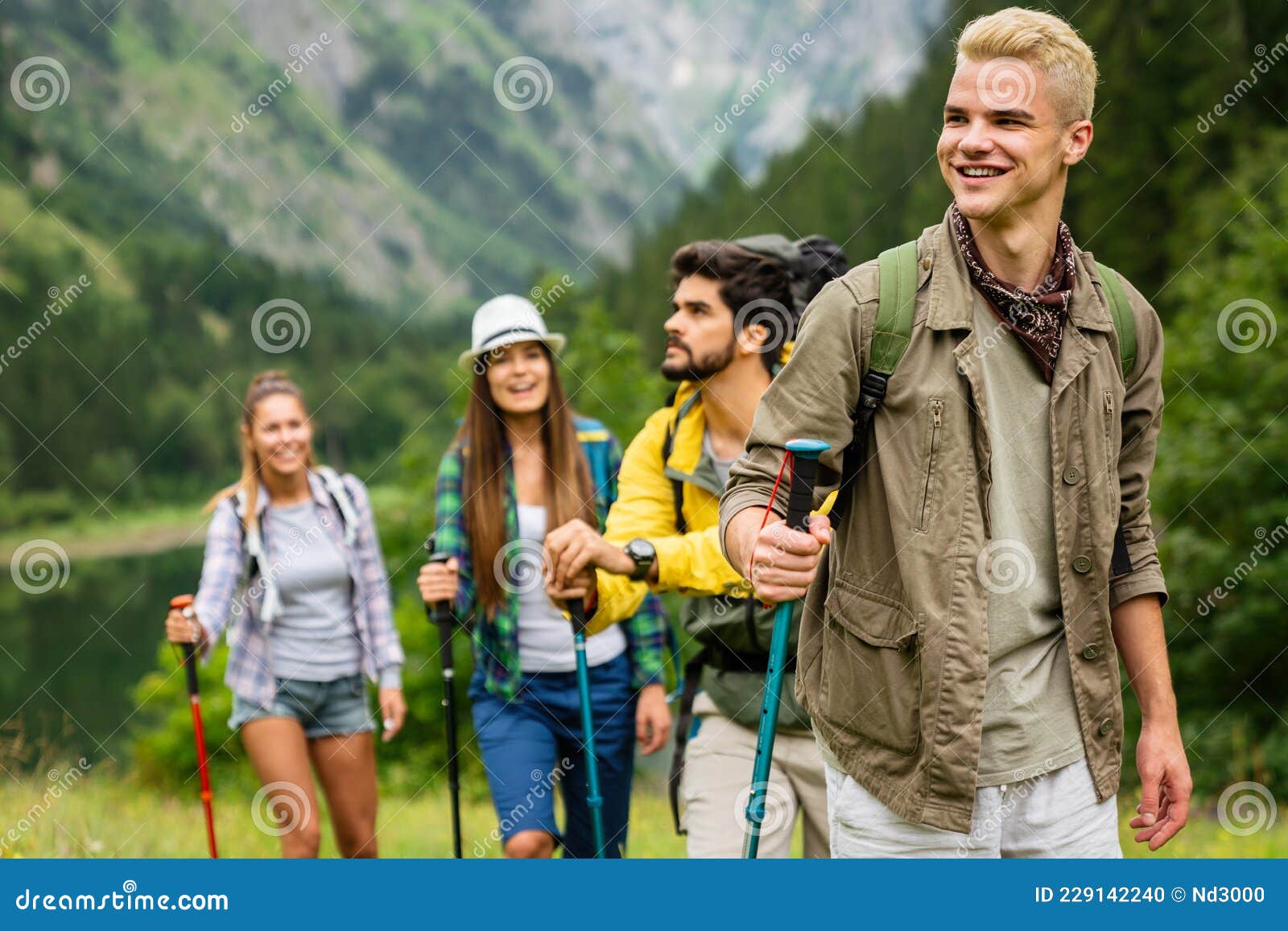 Group of Friends Hiking Together Outdoors Exploring the Wilderness and ...
