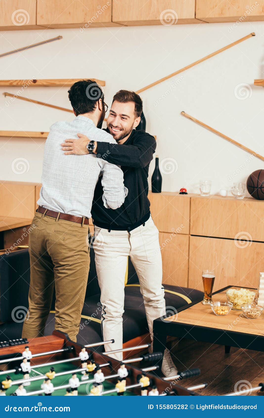 Friends Hugging while Greeting Each Other Stock Photo - Image of ...