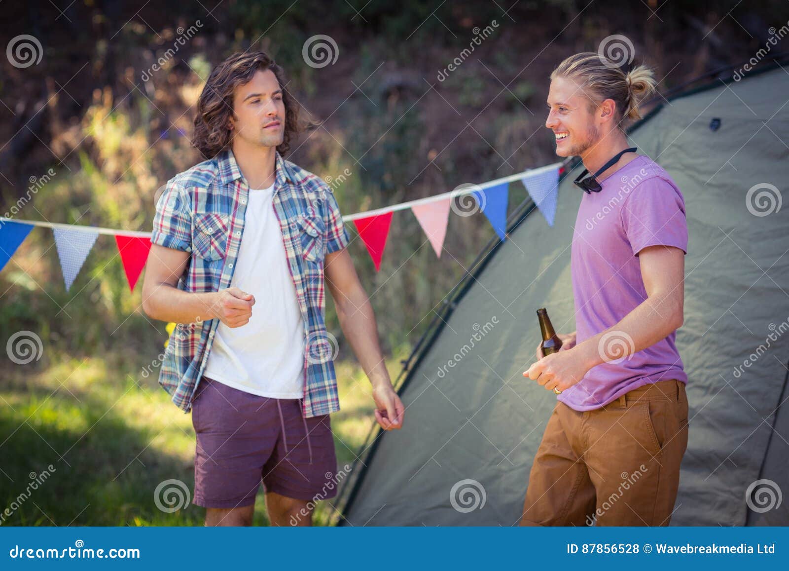 Friends Interacting with Each Other at Campsite Stock Photo - Image of ...