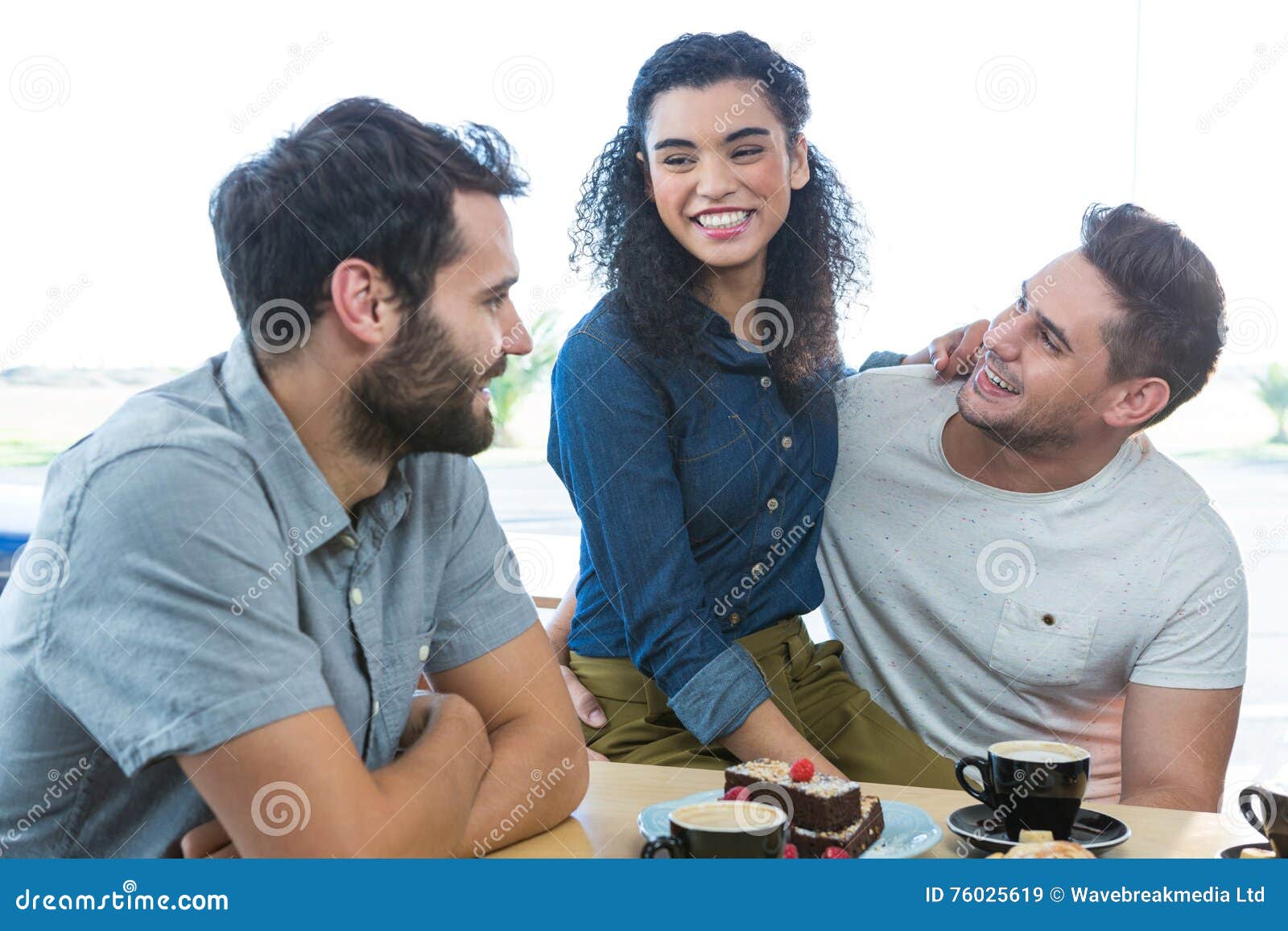 Friends Interacting with Each Other in Coffee Shop Stock Image - Image ...