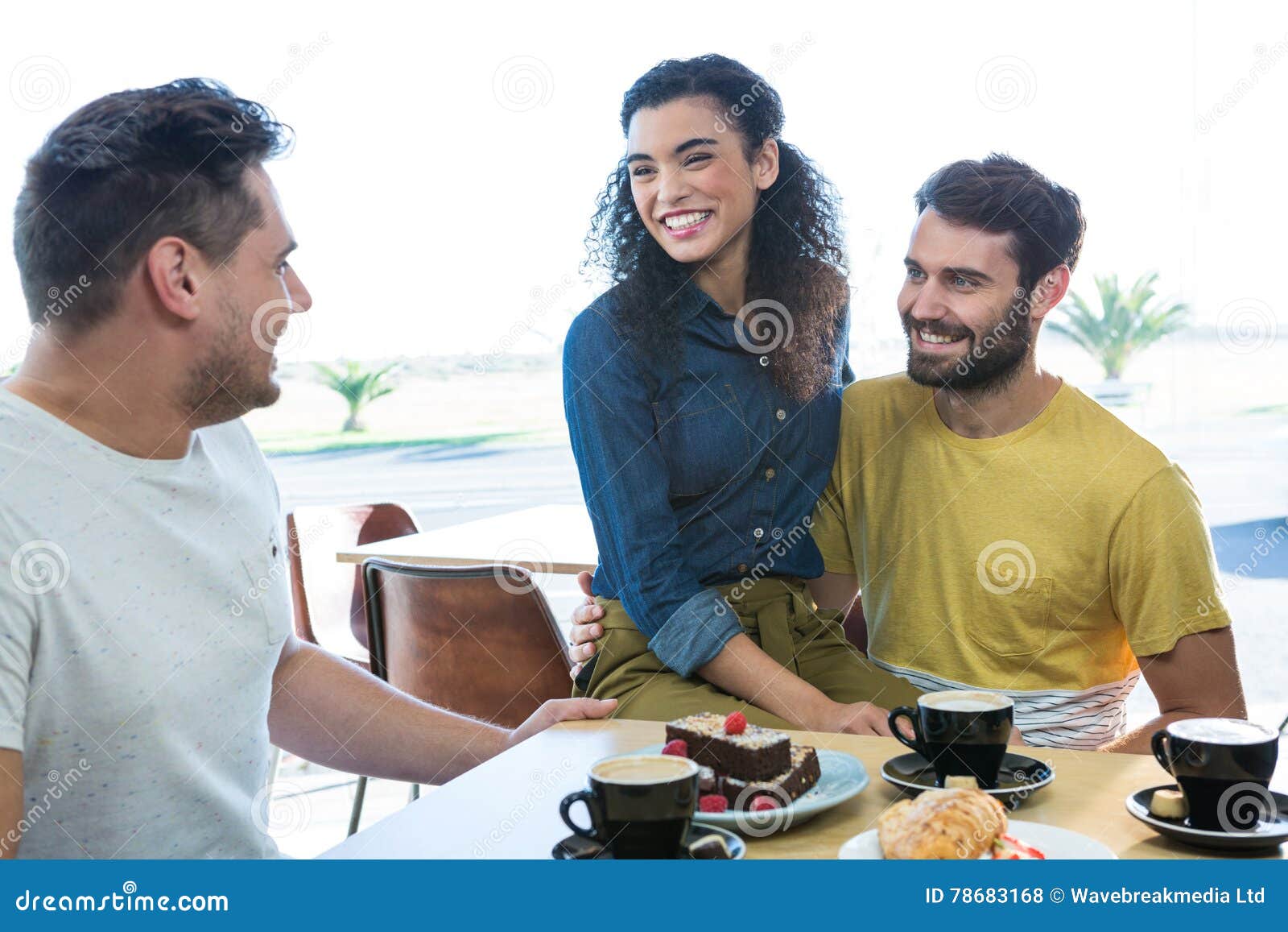 Friends Interacting With Each Other In Coffee Shop Stock Photo - Image ...
