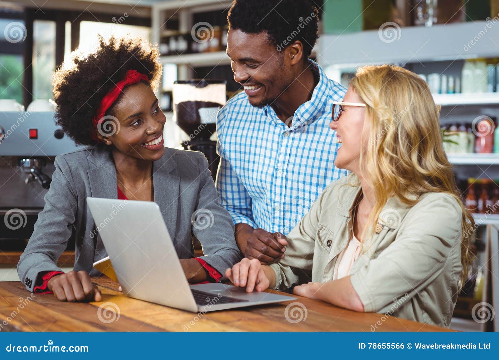 Friends Interacting with Each Other while Working on Laptop Stock Photo ...