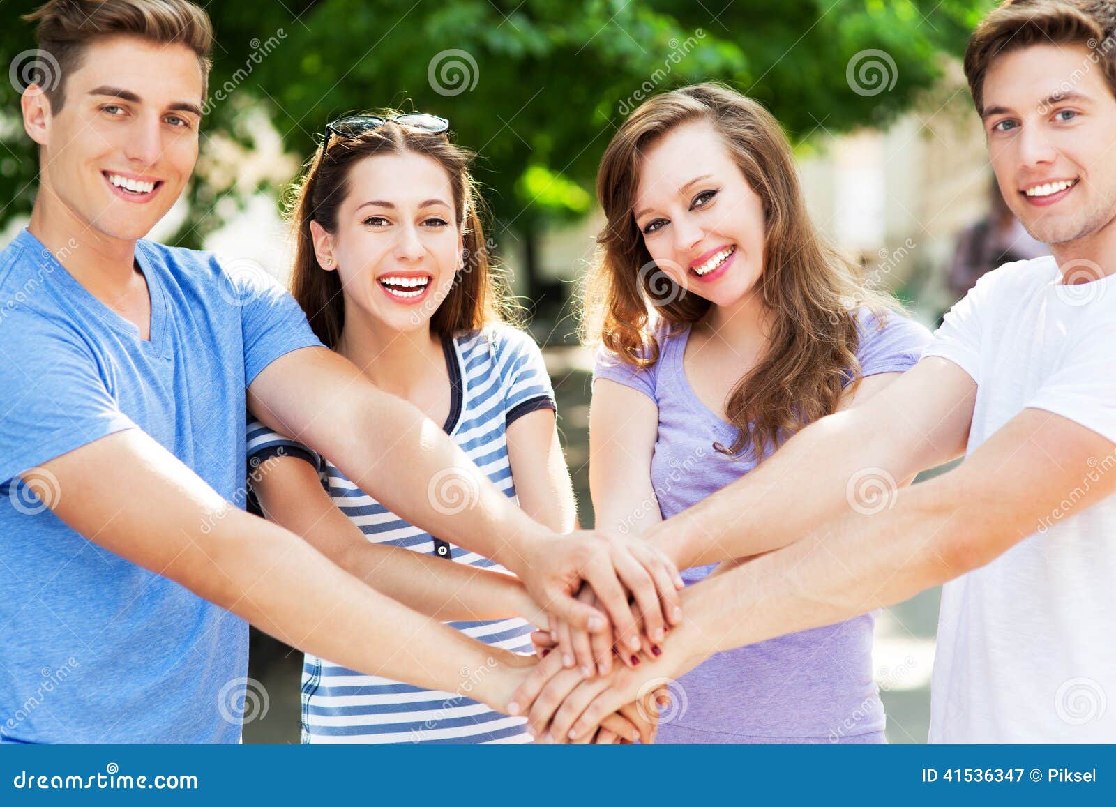 Friends joining hands stock image. Image of cheerful - 41536347